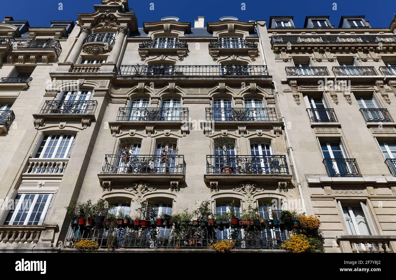 Traditional French house with typical balconies and windows. Paris ...