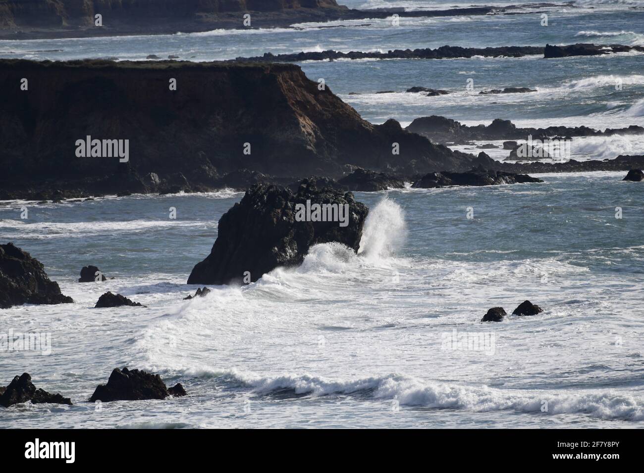 Pacific ocean waves crashing on rocky coast line, California central ...