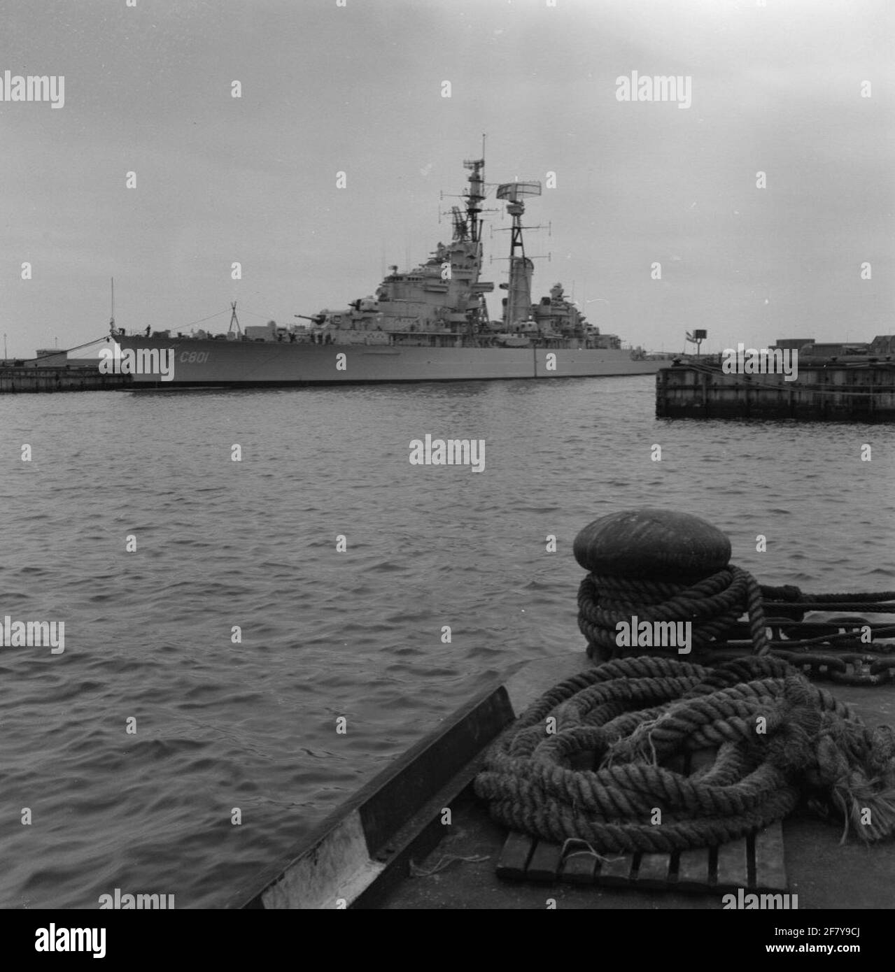 Cruiser Hr.Ms. De Ruyter (C 801) to a jetty in Den Helder, 1957 Stock ...