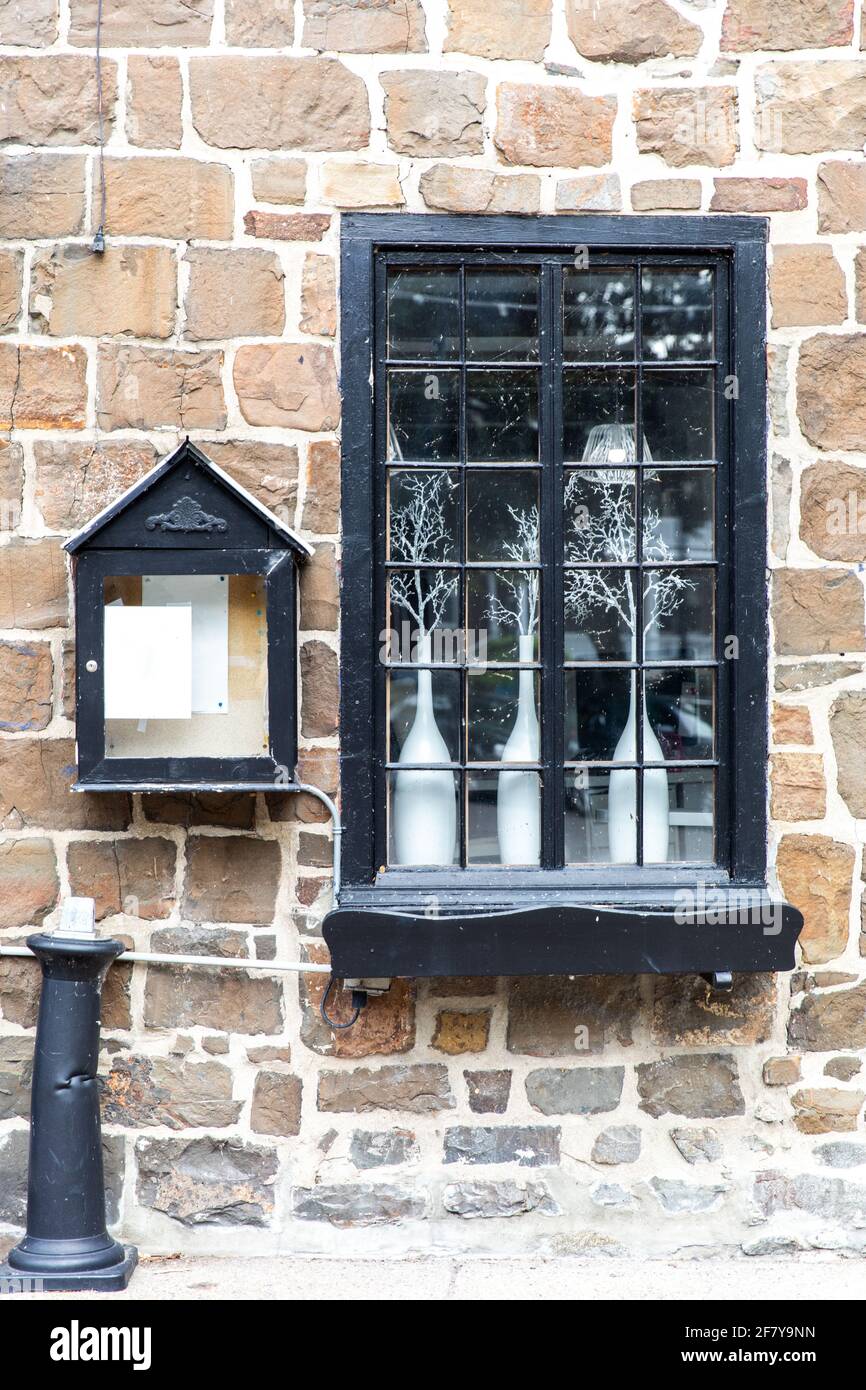 view of a window with a restaurant menu with a stone wall Stock Photo ...