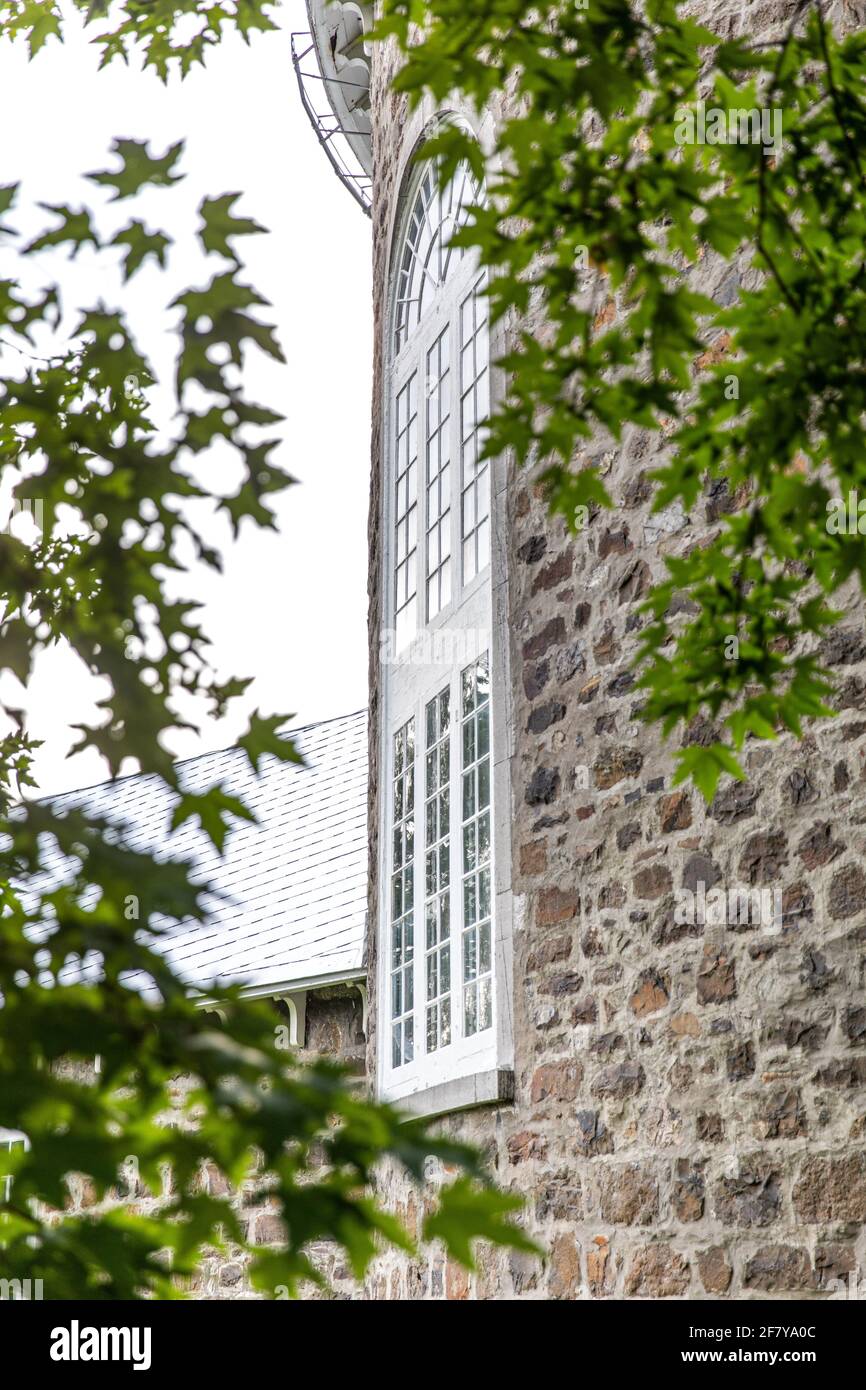 angled view of a tall window on a stone tower Stock Photo - Alamy