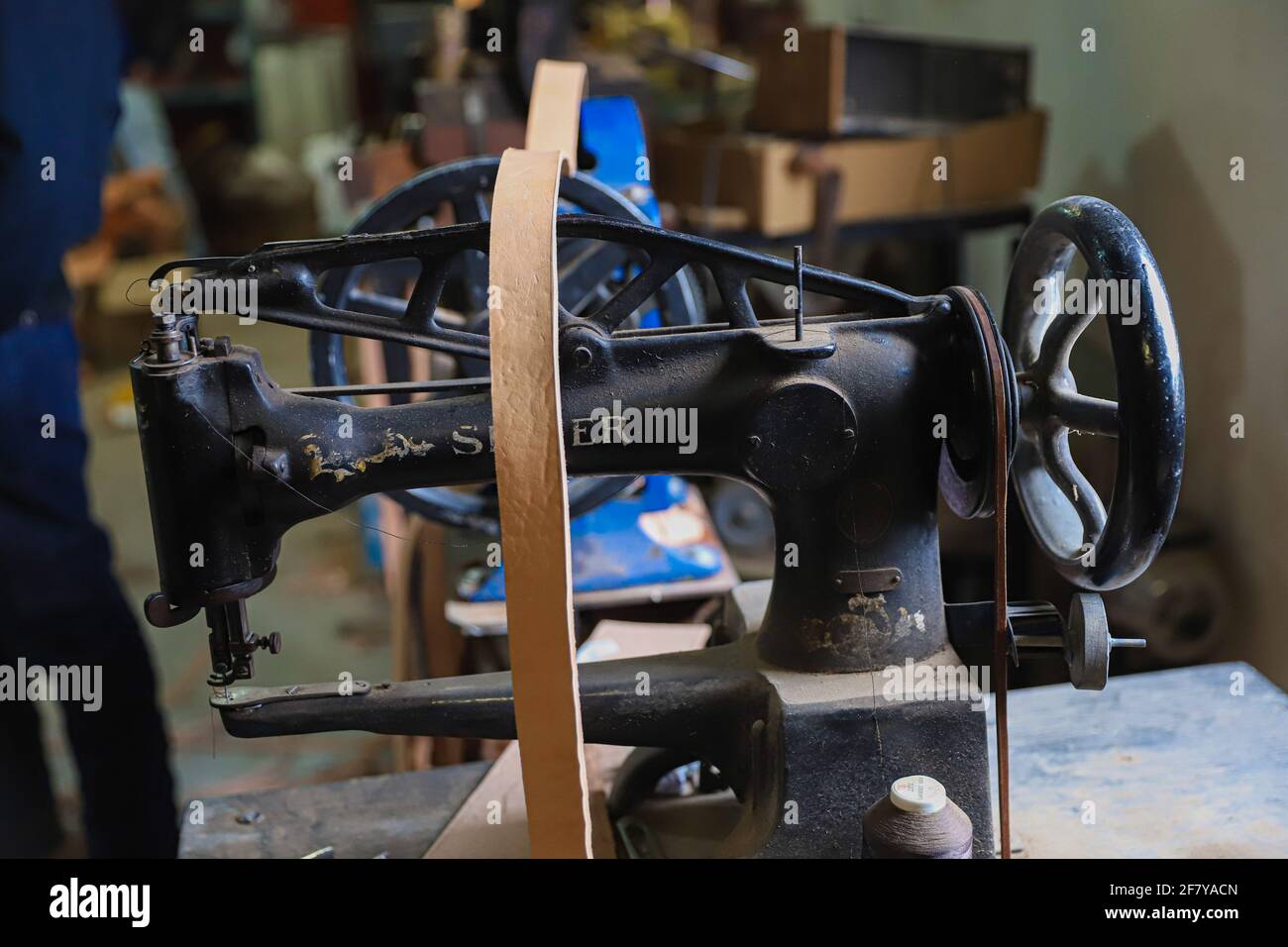 Sewing machine in the factory of boots, saddlery, footwear and leather ...