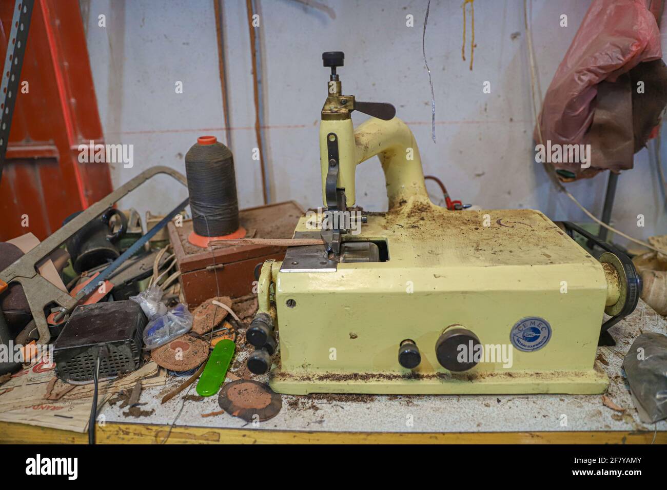 Sewing machine in the factory of boots, saddlery, footwear and leather ...