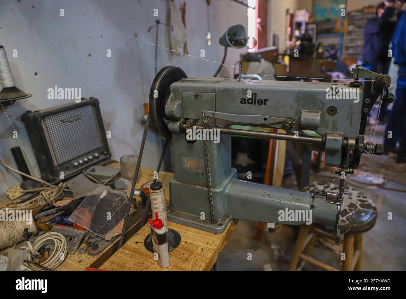 Sewing machine in the factory of boots, saddlery, footwear and leather ...
