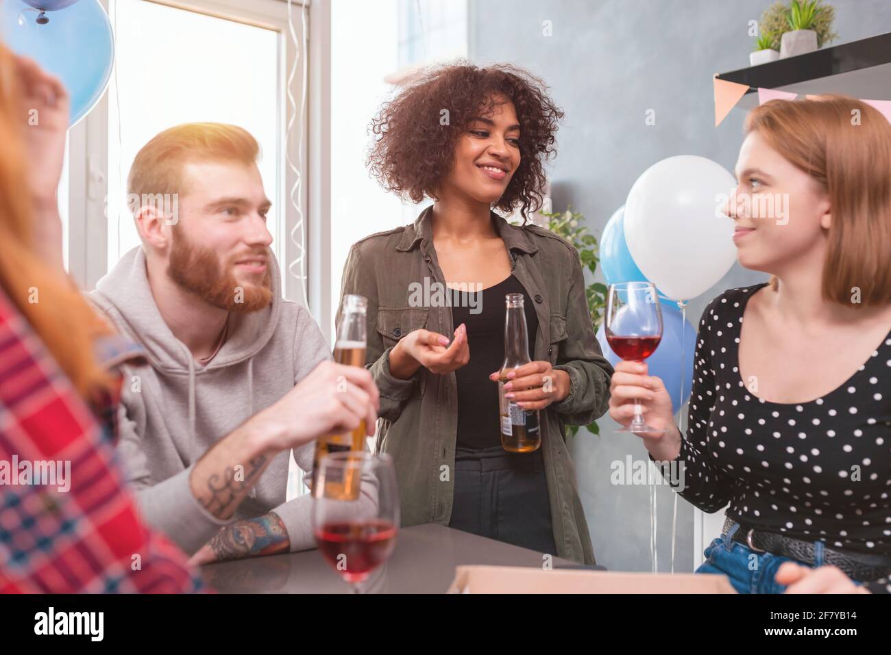 Cheerful friends party eating pizza hi-res stock photography and images ...