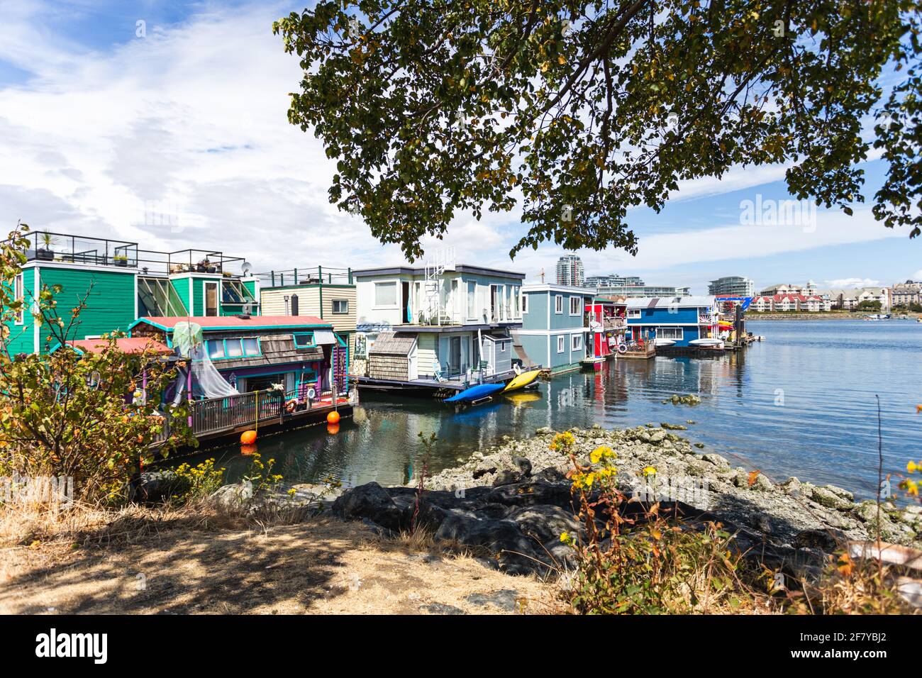Floating houses next to it in summer with blue sky and thin clouds as ...