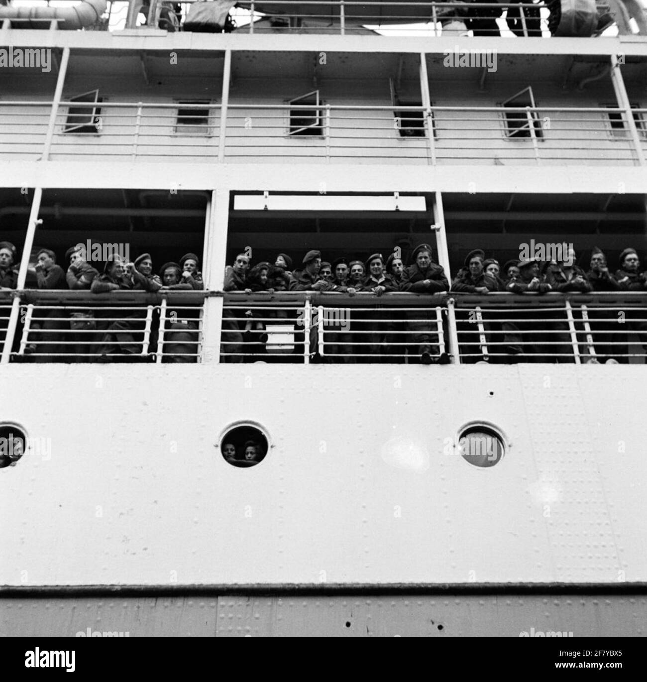 Soldiers hang on the railing of the passenger ship "Johan van ...