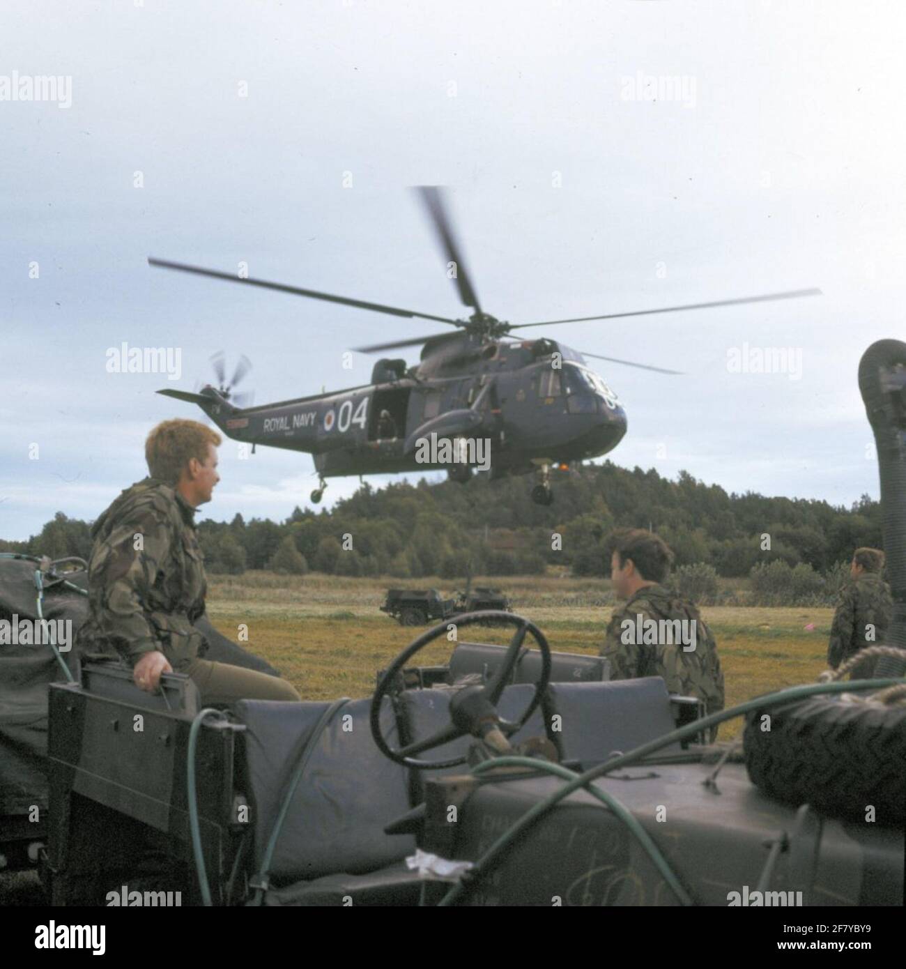 A British Westland Sea King Helicopter transports a jeep Stock Photo ...