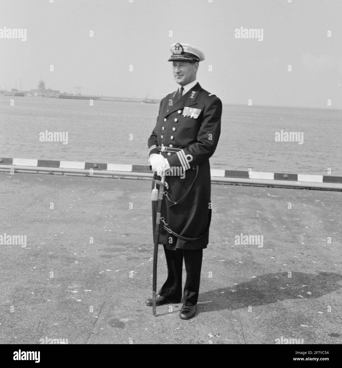 On a jetty, naval crew shows the variety of uniforms that are worn at ...