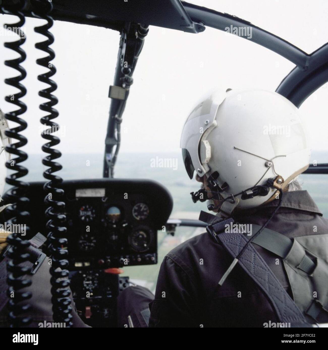 Flyer in the cockpit of an Alouette III helicopter from the SAR above ...