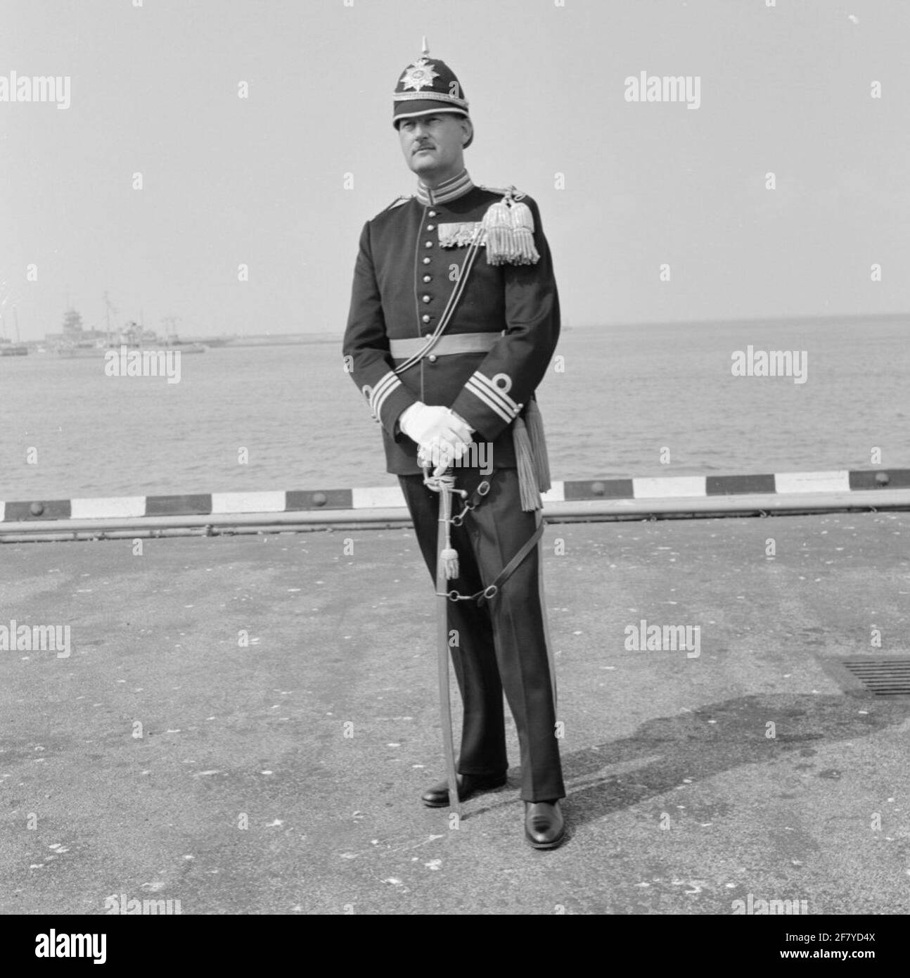 On a jetty, naval crew shows the variety of uniforms that are worn at ...