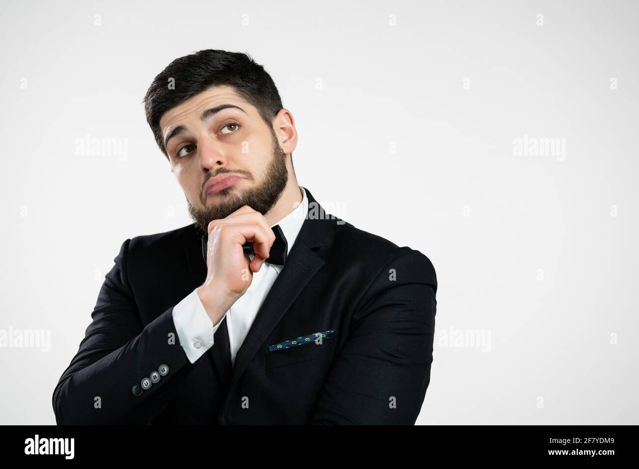 Thinking man looking up on white background. Pensive face expressions ...