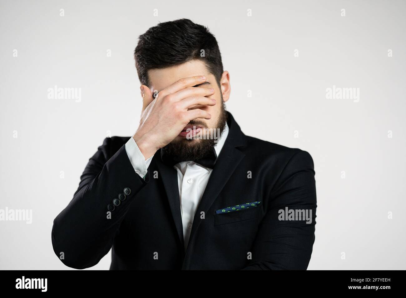 Portrait of man doing facepalm gesture, like no, I forgot. Unhappy guy ...