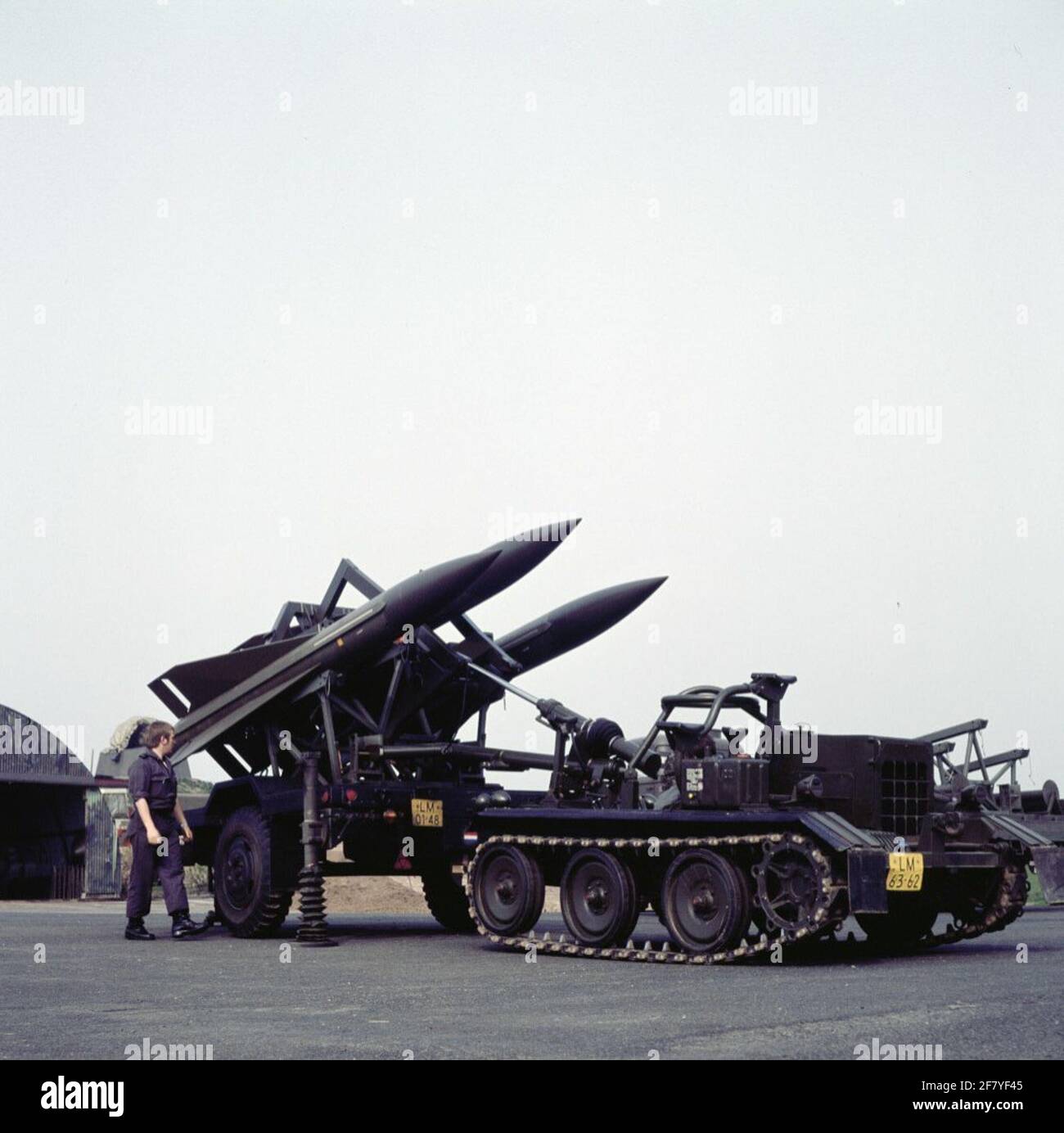 Airborne soldiers at work at a launcher with Hawk rocket. 5th group of ...