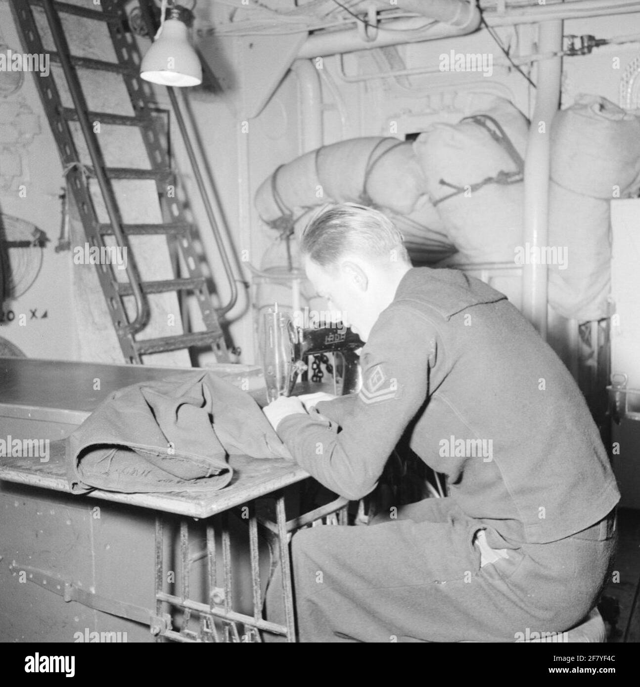 The tailor at work A / B of the torpedo boat hunter Hr.Ms. Evertsen (D ...