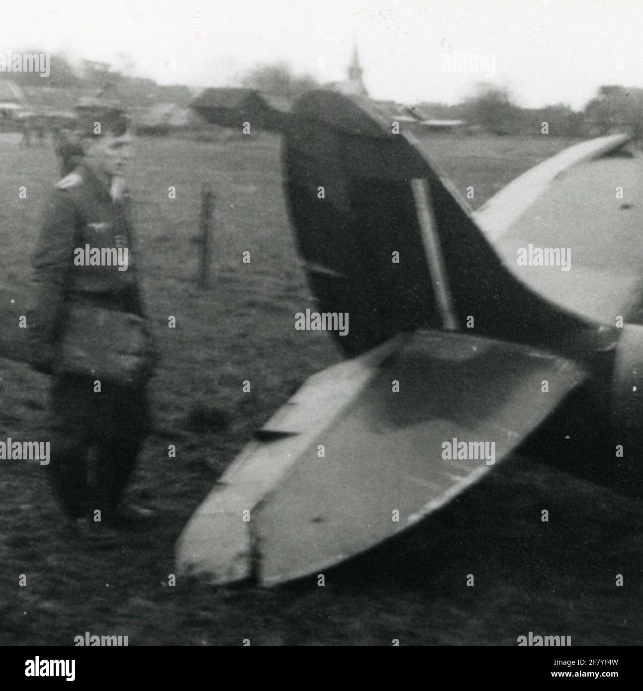 A German soldier at the tail of a spitfire crashed Stock Photo - Alamy