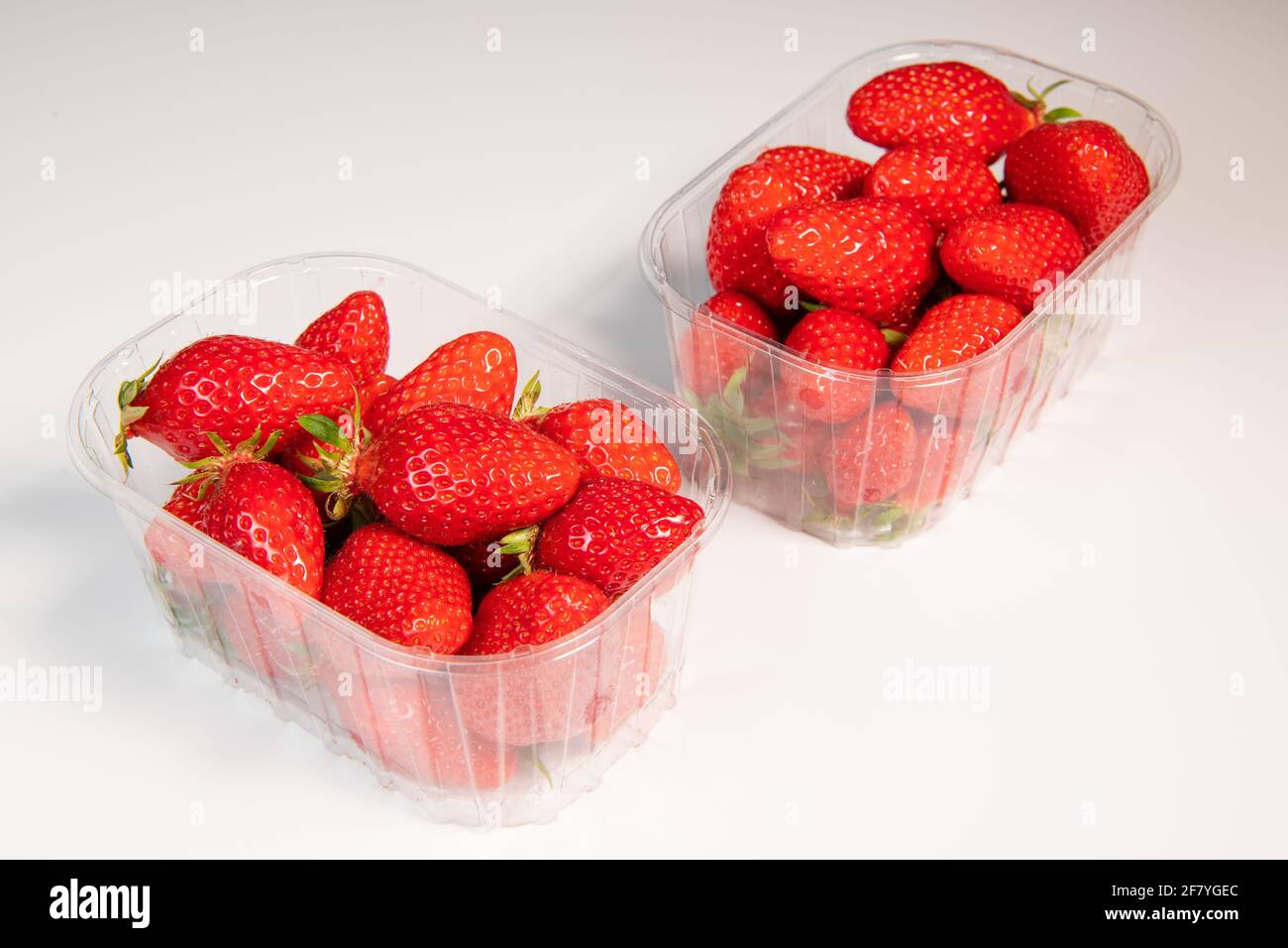 Punnet of strawberries isolated on white background Stock Photo - Alamy