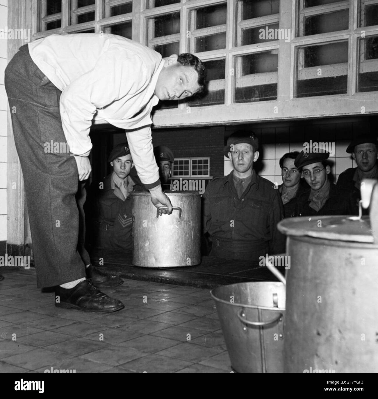 Boilers with food are picked up at the kitchen by soldiers Stock Photo ...