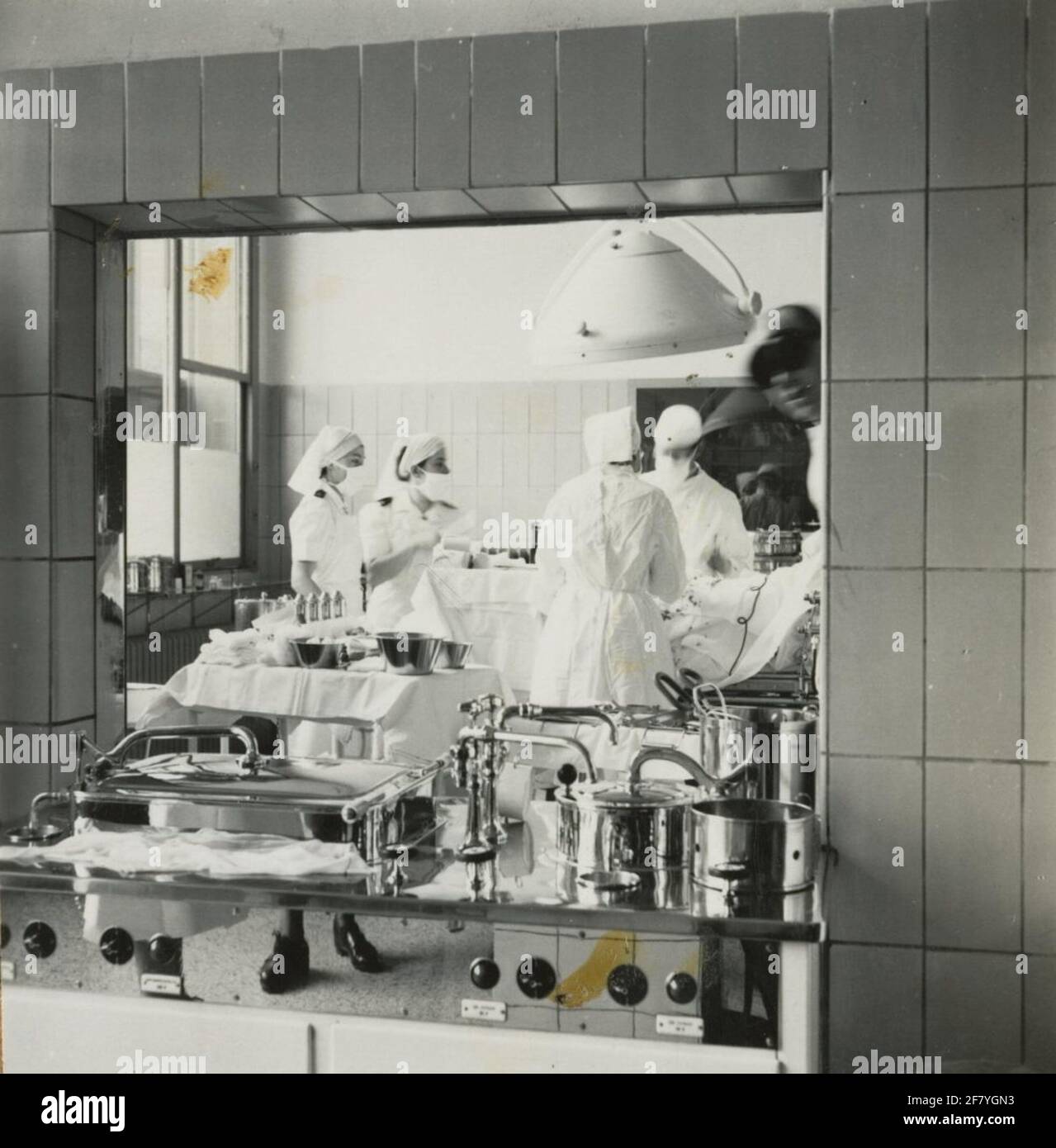 Medical service staff, including a few milvas, at work in an operating ...
