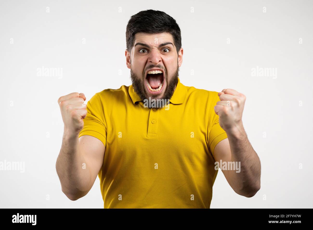 Angry stressed man shouting isolated over white background. Depressed ...