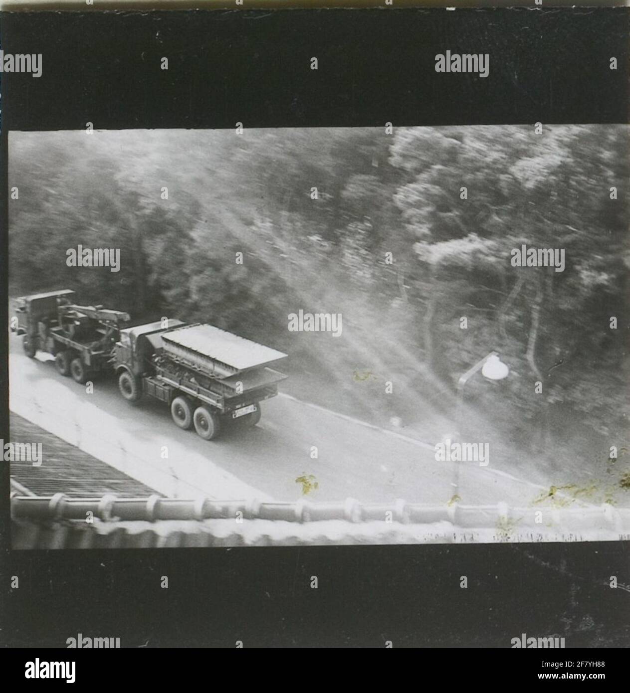 A DAF YB-616 tow truck drags a DAF YK-616 chicken car away, loaded with ...