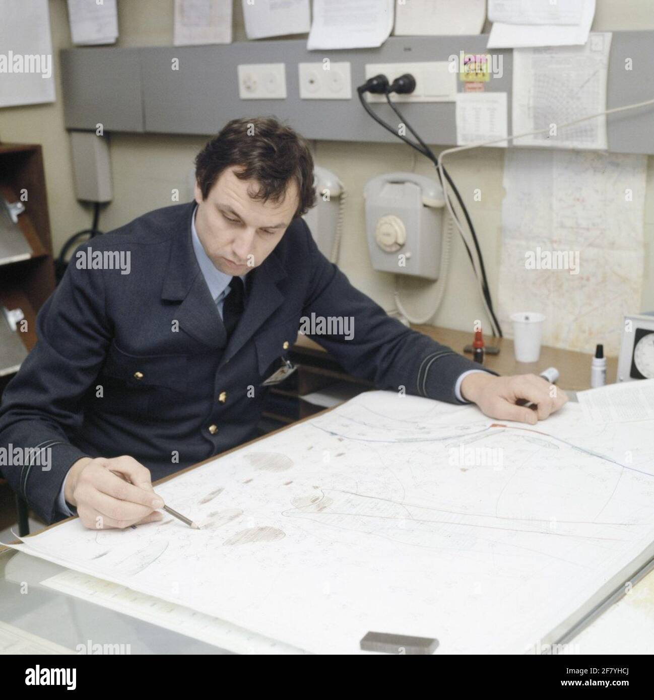 A Meteo officer at work with subscribing to a weather map Stock Photo ...