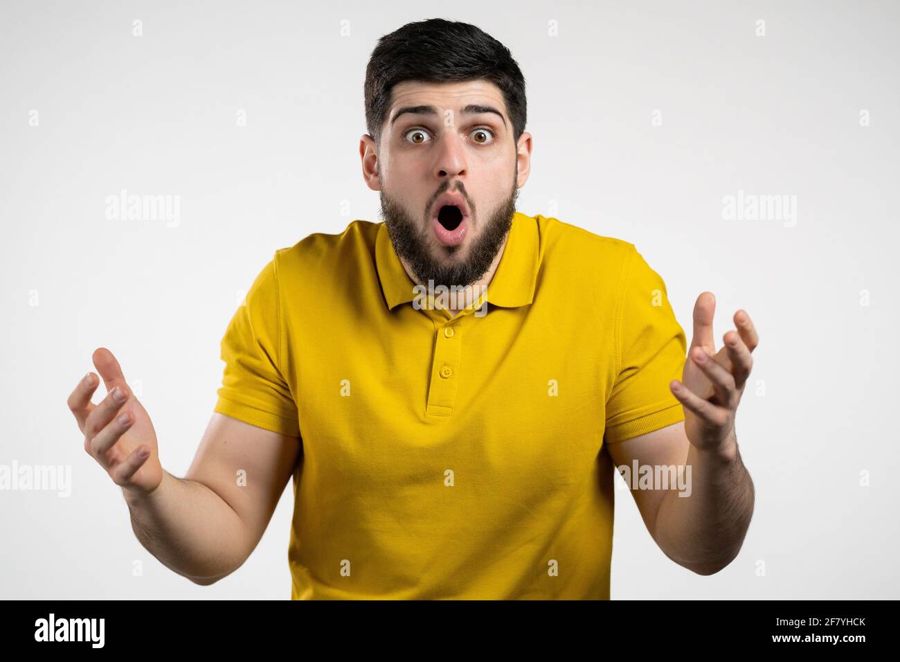 Man depicts amazement, shows WOW delight face effect. Surprised excited ...