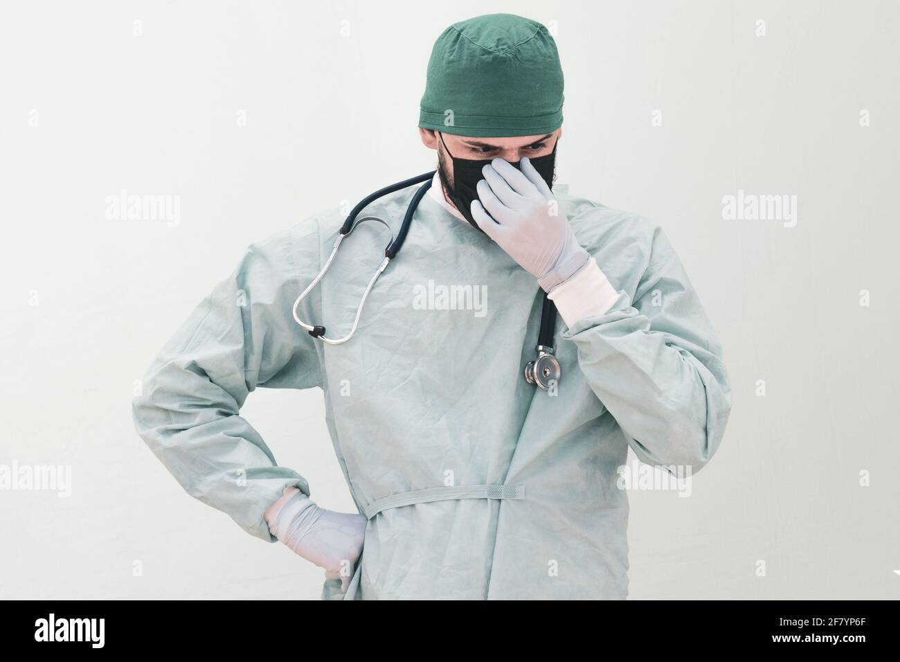 Stressed male doctor disappointed after a surgery Stock Photo - Alamy