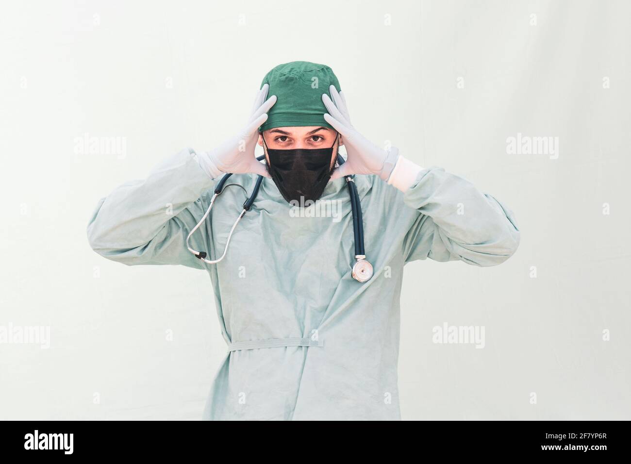 Male doctor preparing for surgery isolated on a white background Stock ...