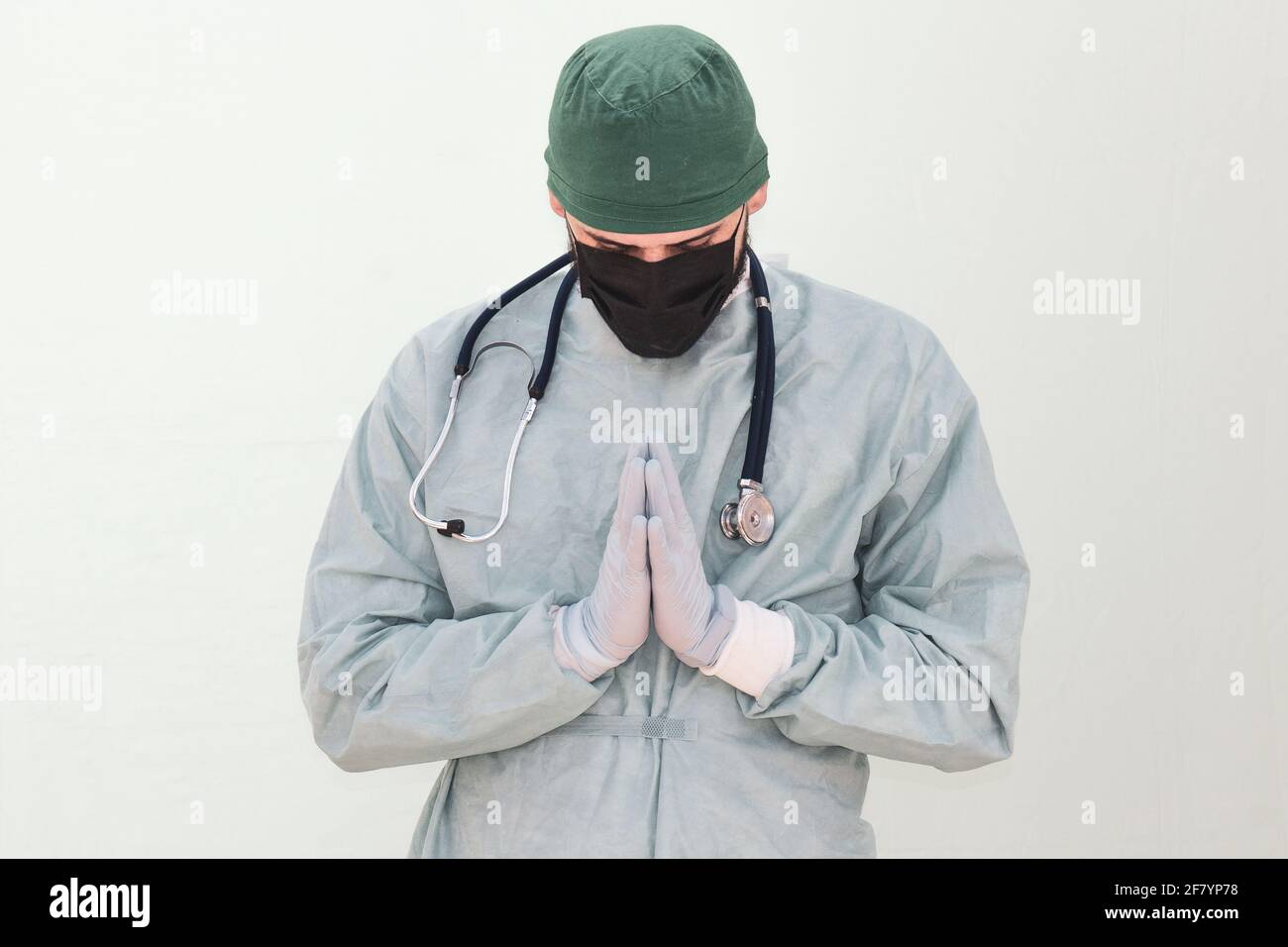 Male doctor praying for a surgery to go well Stock Photo - Alamy