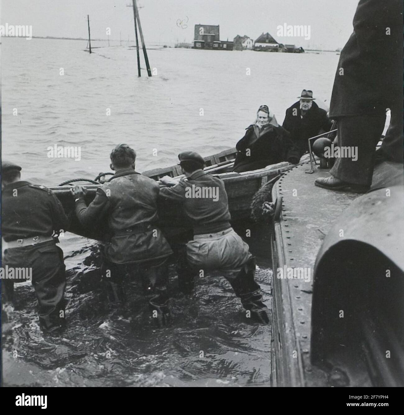 Water release disaster 1953. Dutch soldiers evacuate residents from the ...