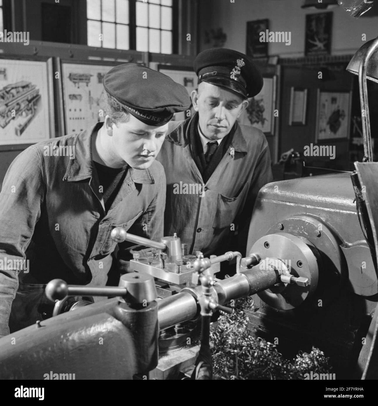 Operator in training at lathe Stock Photo - Alamy