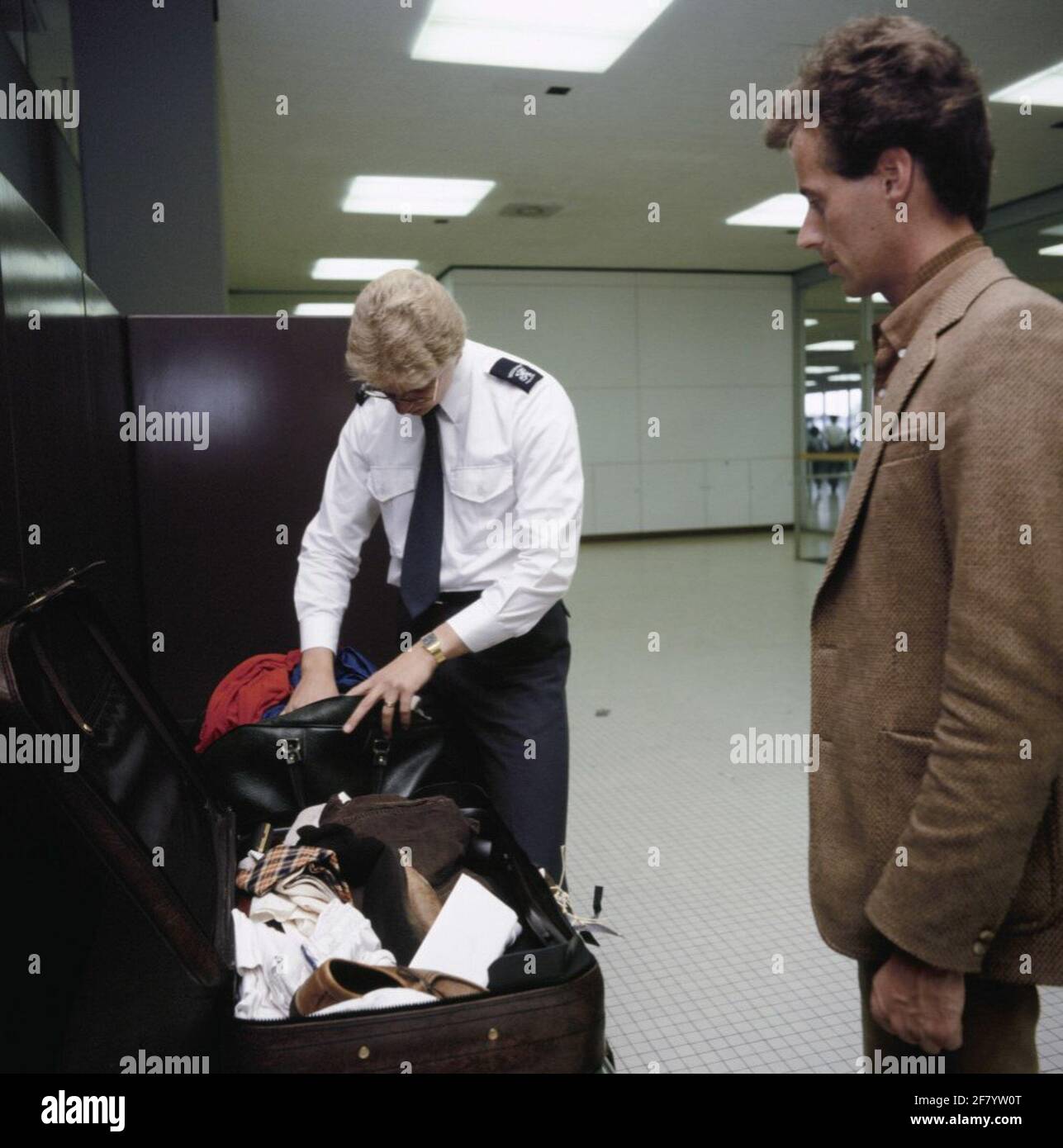 Officer airport checking hi-res stock photography and images - Alamy