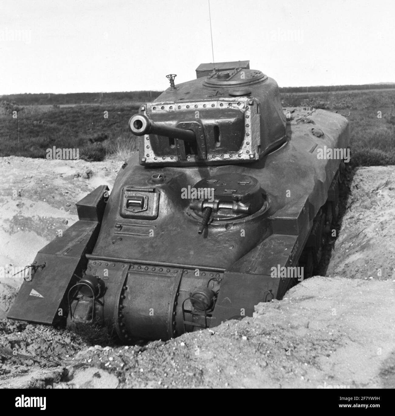A medium combat tank of the RAM II type in a covered setup during an ...