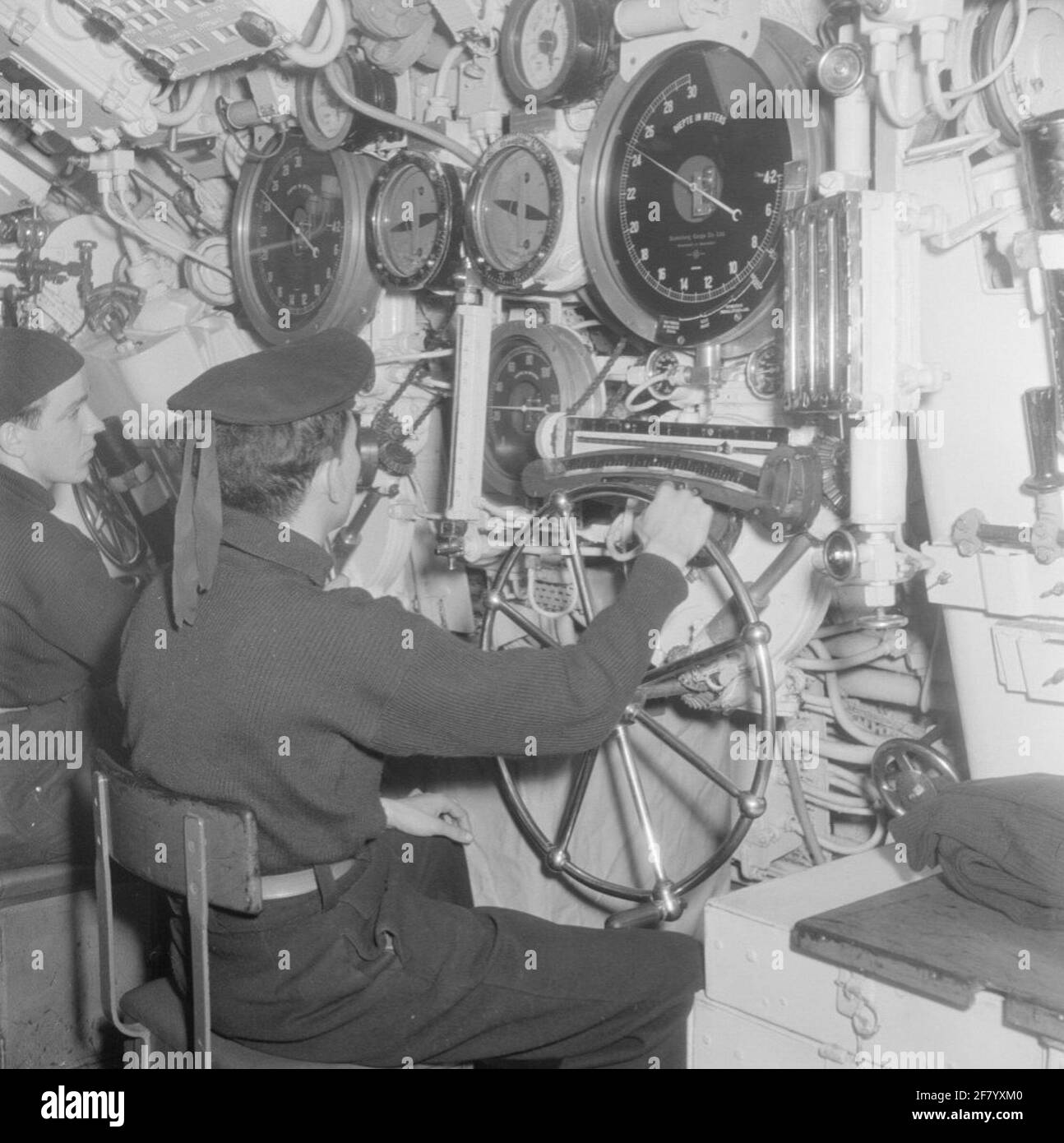 Sailor sitting behind the deeper ground of a submarine Stock Photo - Alamy