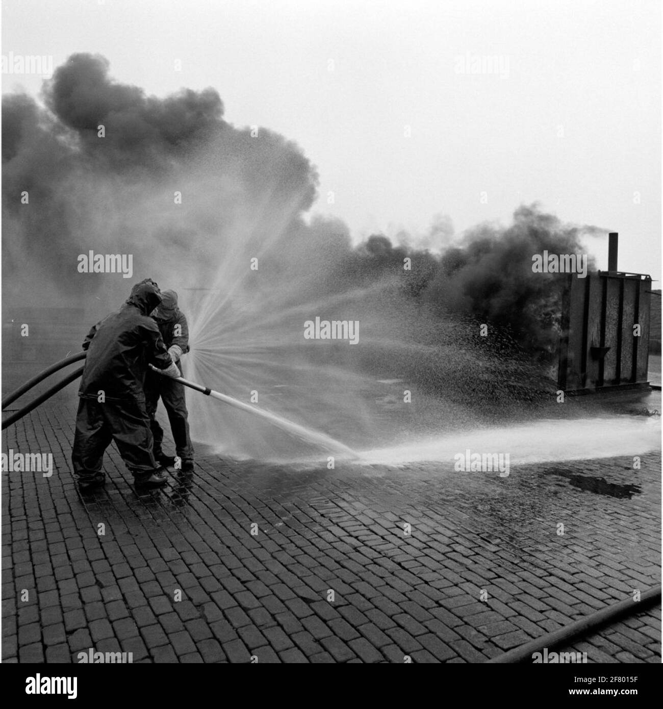 Exercise fire fighting at the school for NBCD (nuclear, organic ...