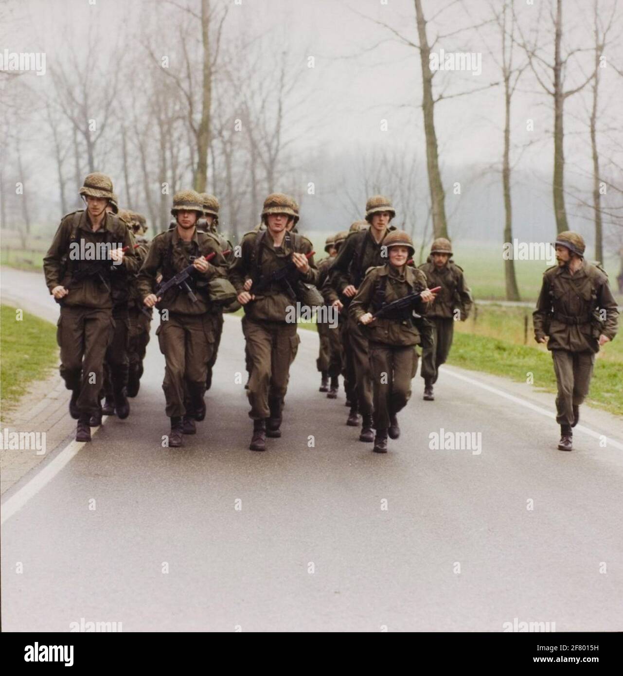 A group of soldiers, armed with Uzi, during a speed march Stock Photo ...