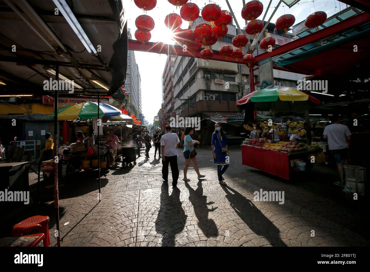 People wearing face masks as a preventive measures against the spread ...
