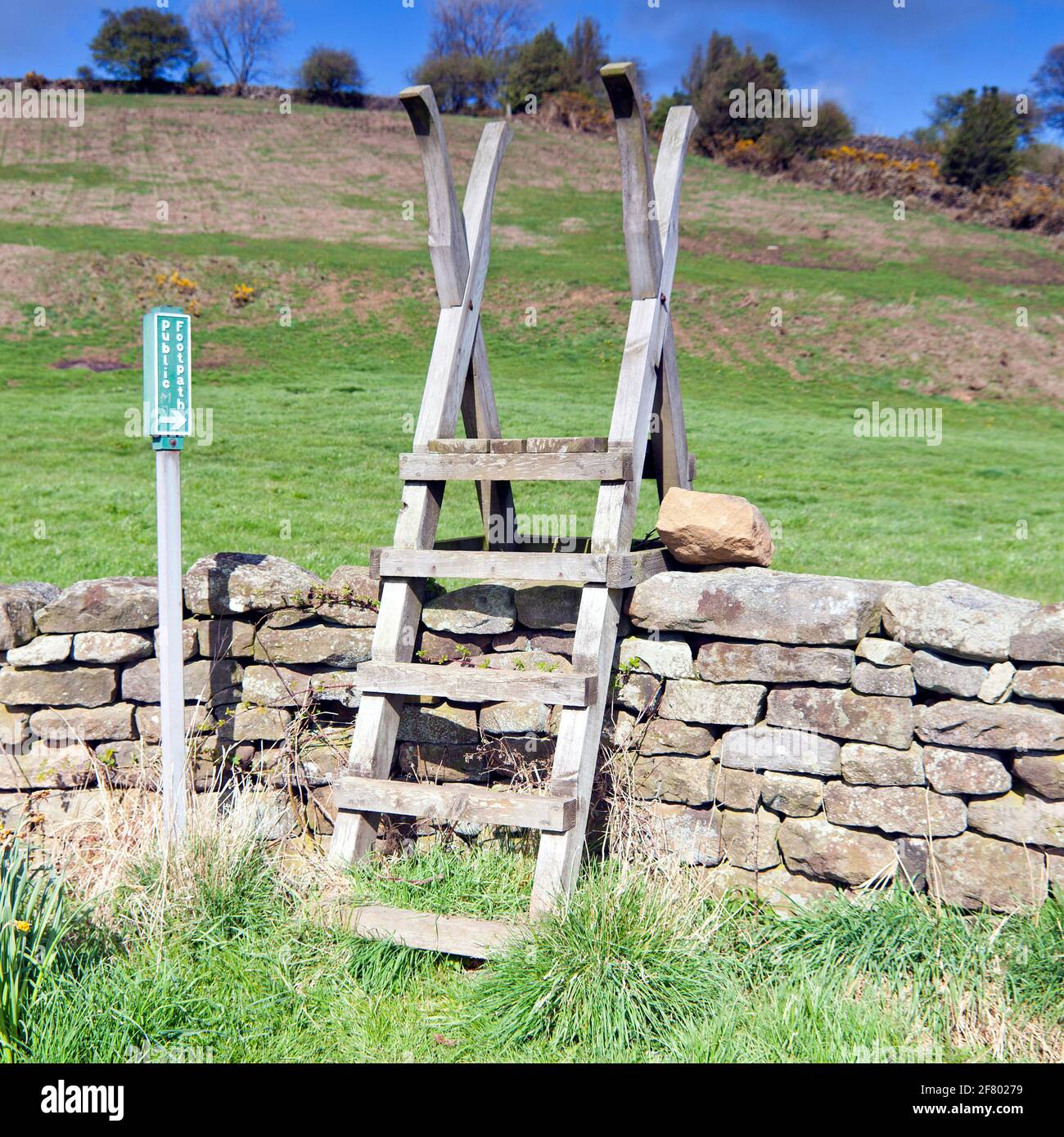Public Footpath step stile over dry stonewall in the North Yorkshire ...