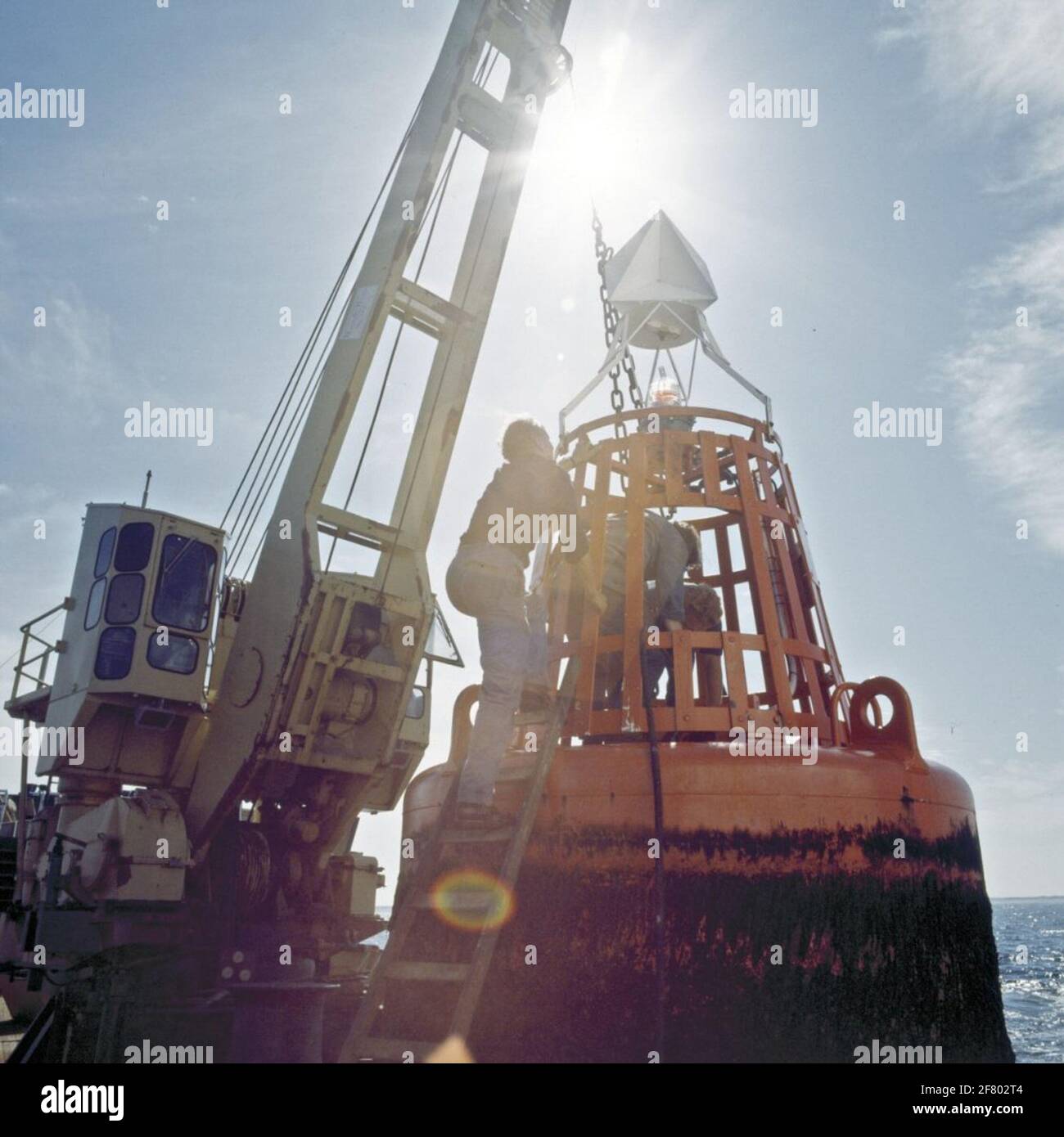 Maintenance of a light buoy on the Breevertien (1973-1997 Stock Photo ...