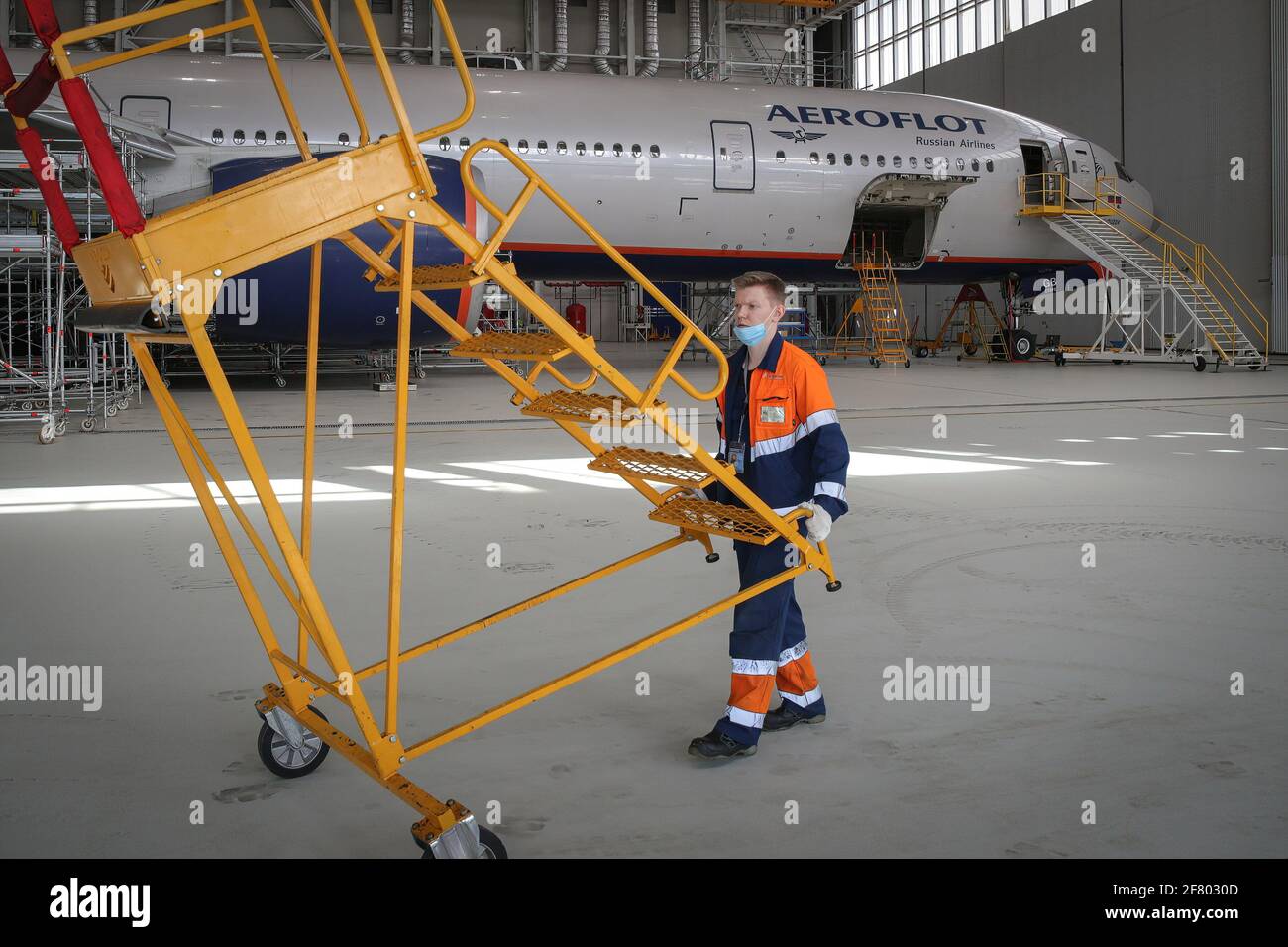 An employee moves the service stair, during the opening of the A ...