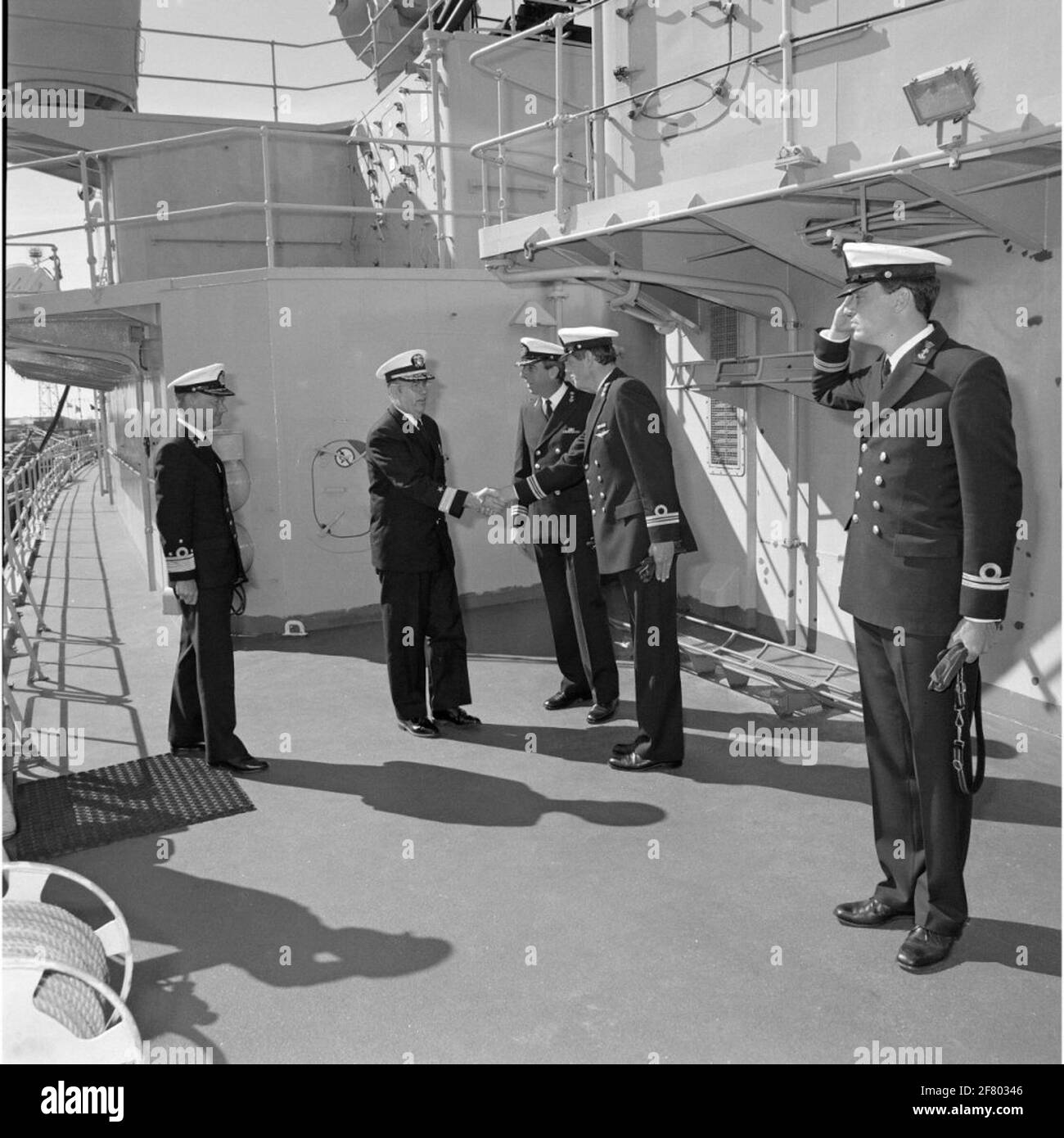 An American Admiral (second from the left) visits the naval base Den ...