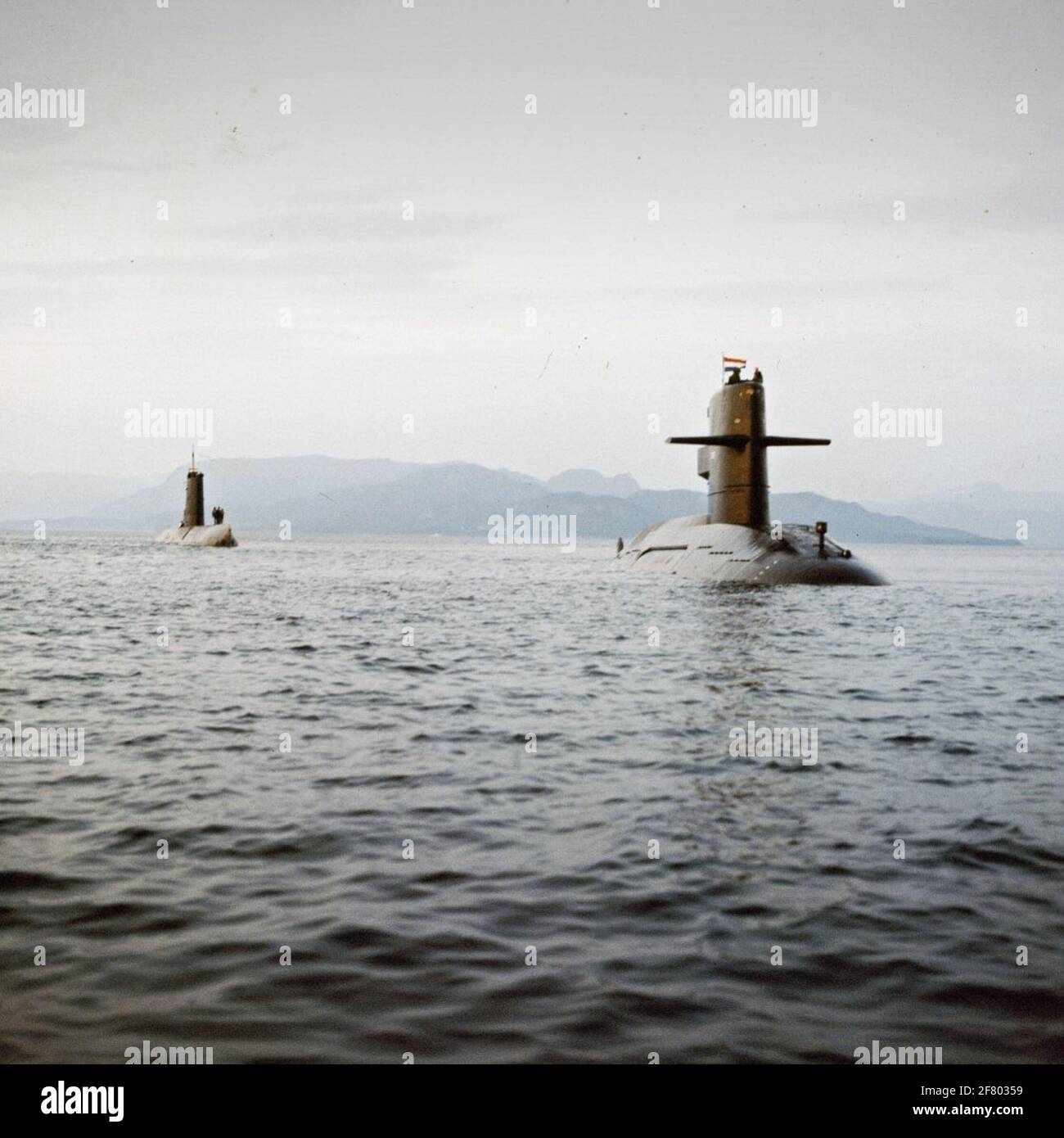 The submarine Hr.Ms. Tiger shark (1972-1995) with a foreign submarine ...