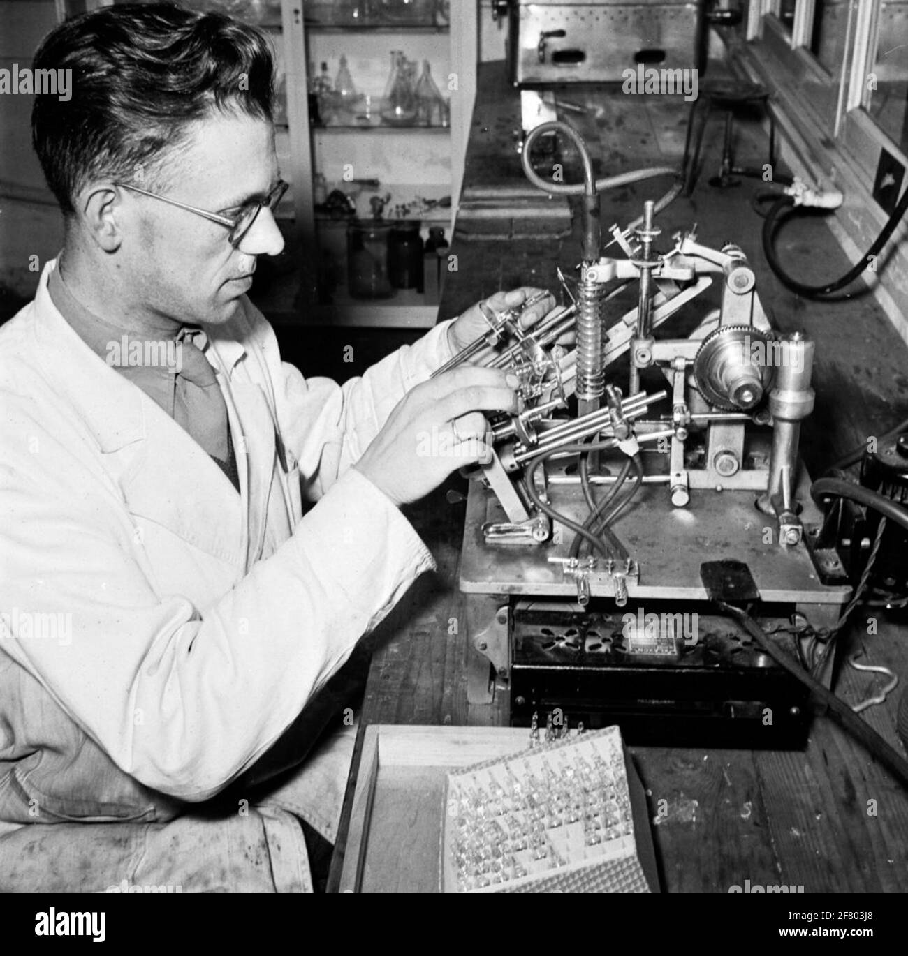 Filling glass tubes. A fire extinguisher Stock Photo - Alamy