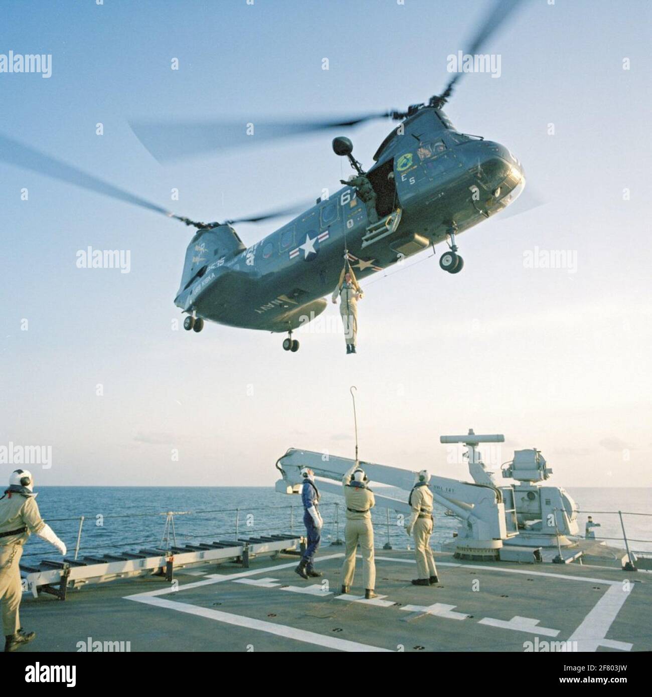 From an American Boeing CH-46 Sea Knight, a soldier from the USS Kiska ...