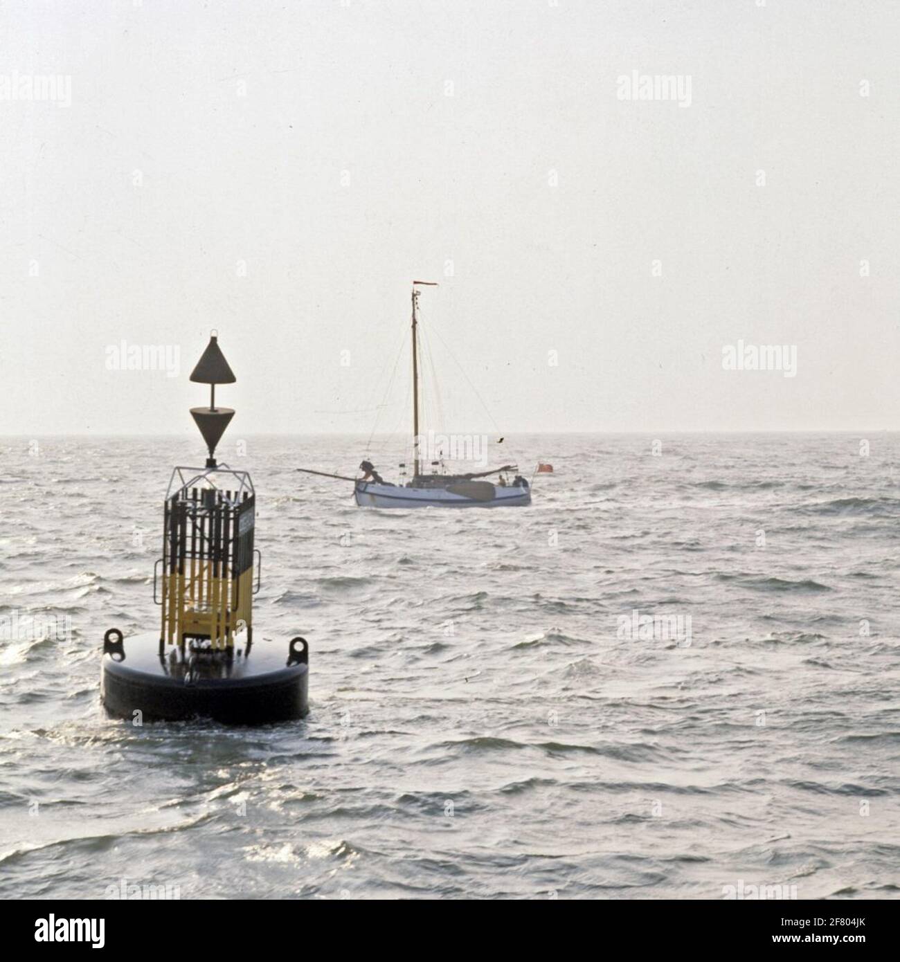 Eastern cardinal buoy with a flat bottom recreational in the background ...