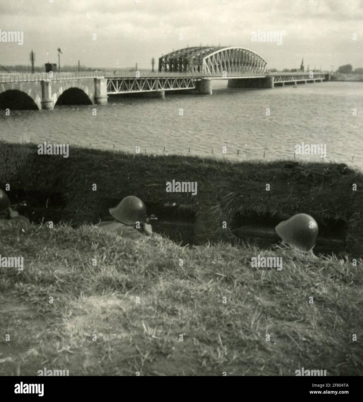 Three soldiers with imposed rifle in an infantry with a view of the ...