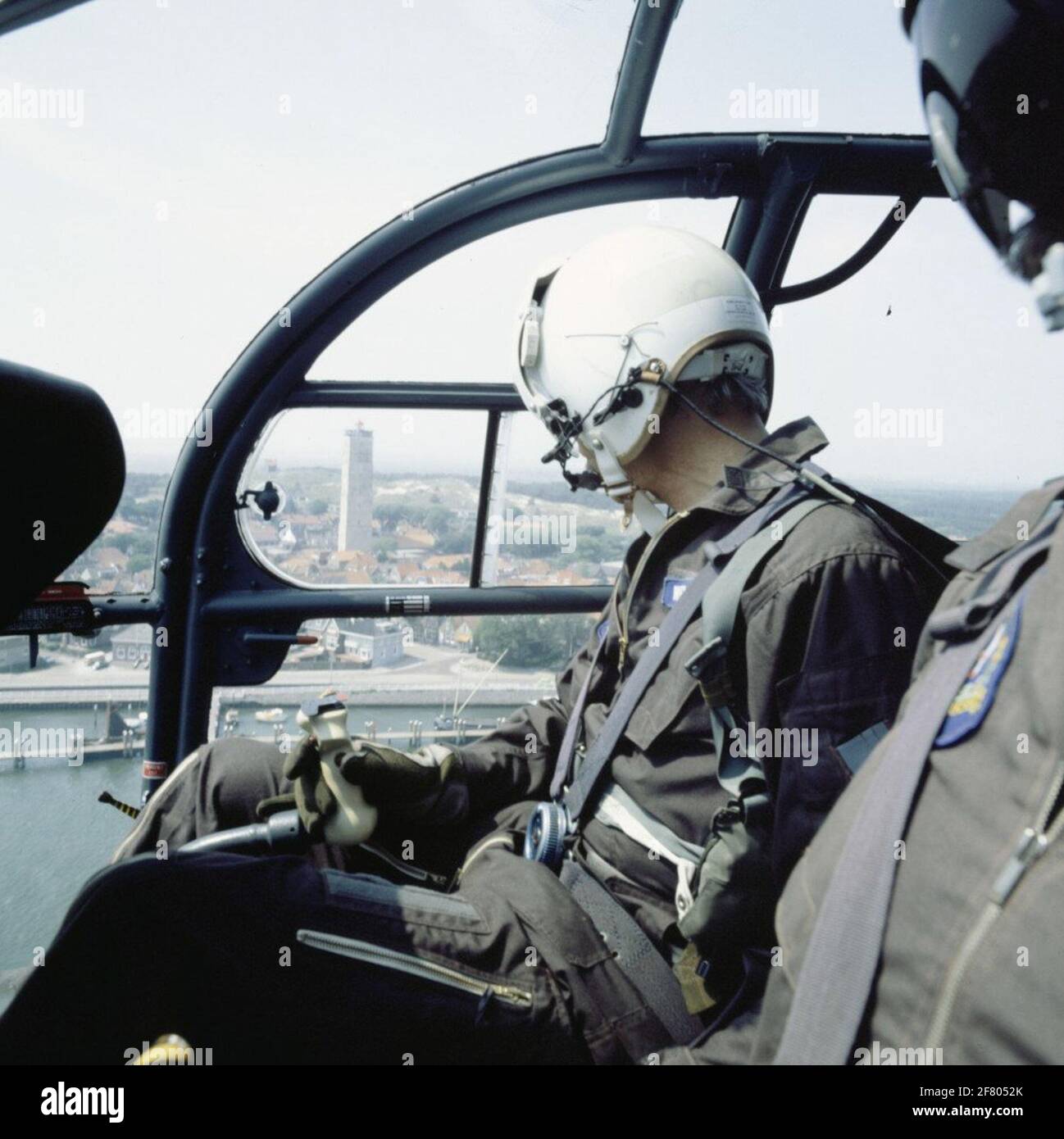 Flyer in the cockpit of an Alouette III helicopter from the SAR above ...