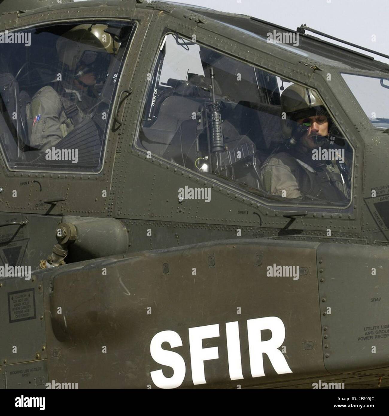 Crew of a Boeing Apache AH-64D combat helicopter Stock Photo - Alamy