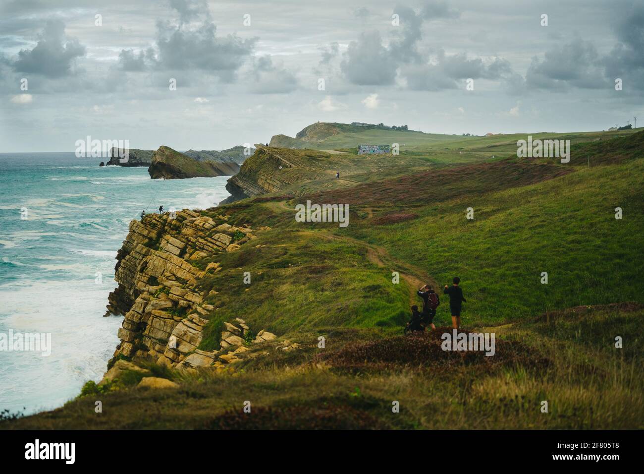 People walking in the cliffs Stock Photo - Alamy